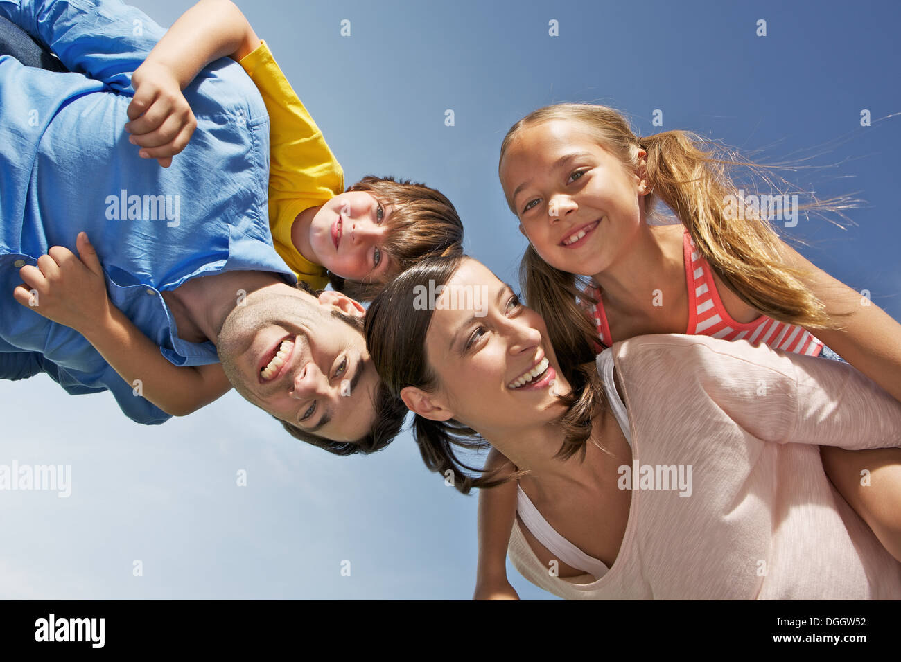 Portrait of family with two children from below Stock Photo - Alamy