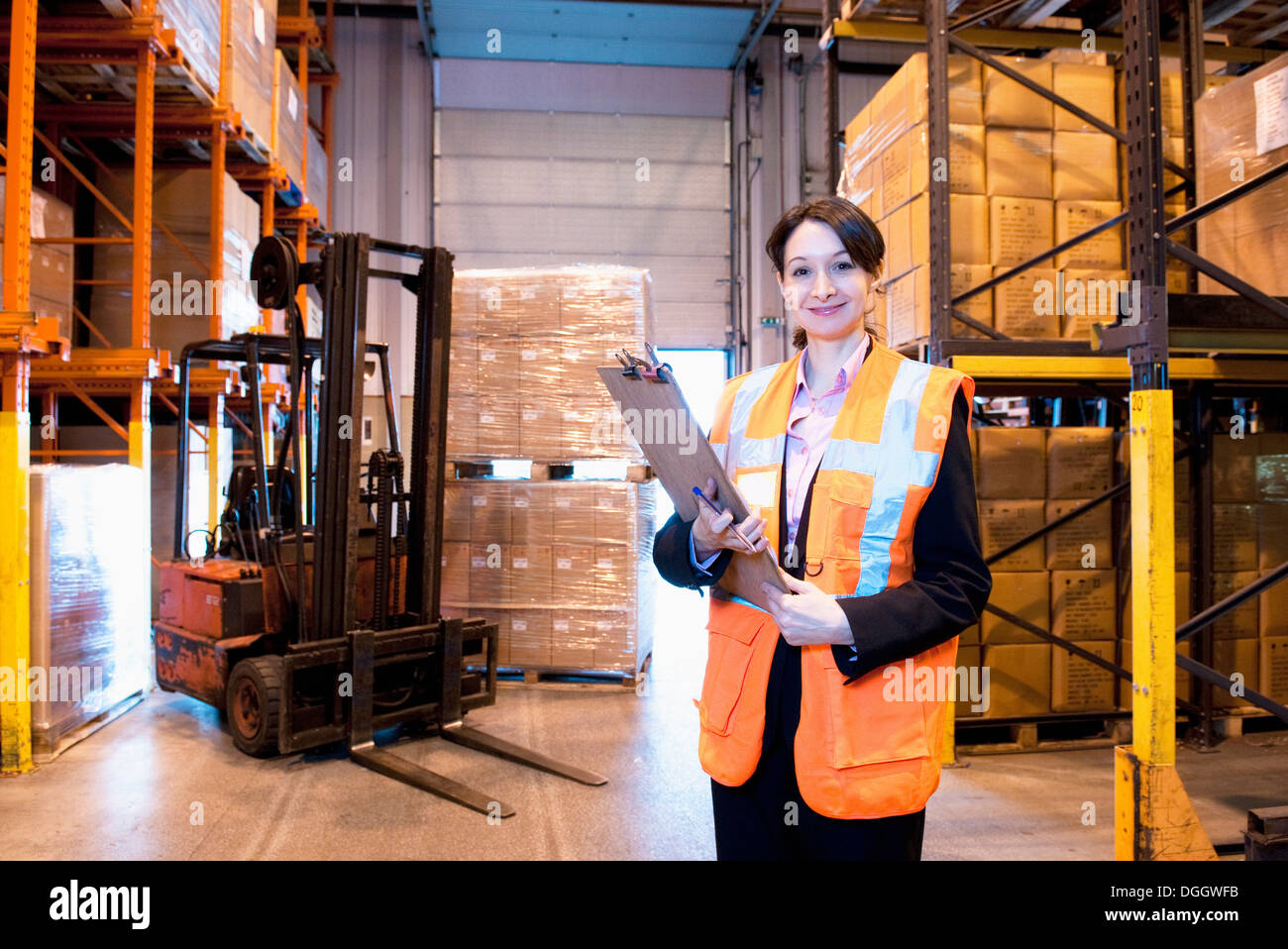Female supervisor in warehouse Stock Photo - Alamy