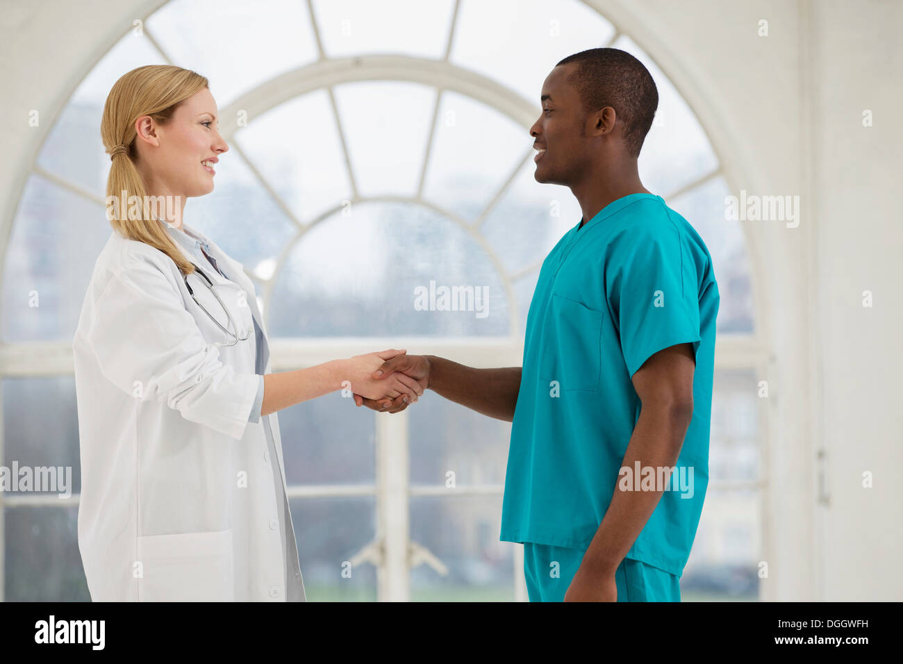 Two doctors shaking hands Stock Photo - Alamy