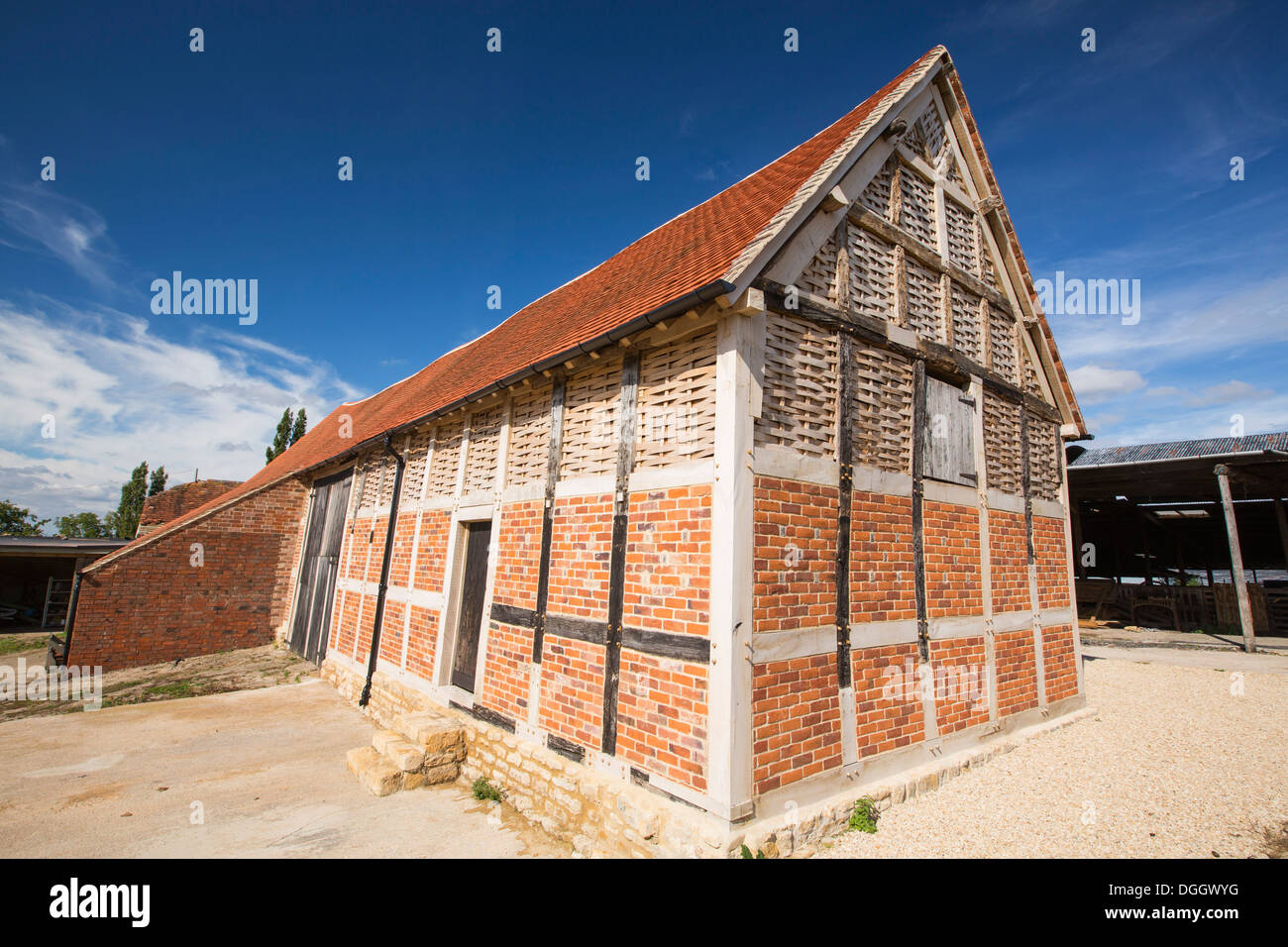 A fantastic old barn with upper walls woven from split timber on a farm ...