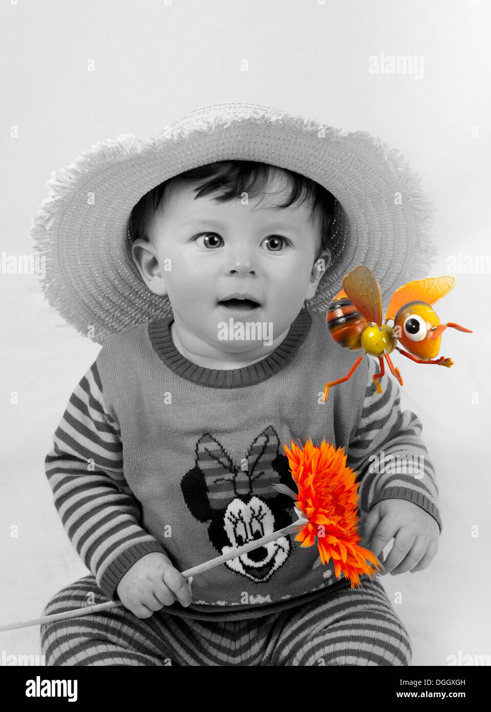 baby girl with happy face, selective color, orange flower and big ...