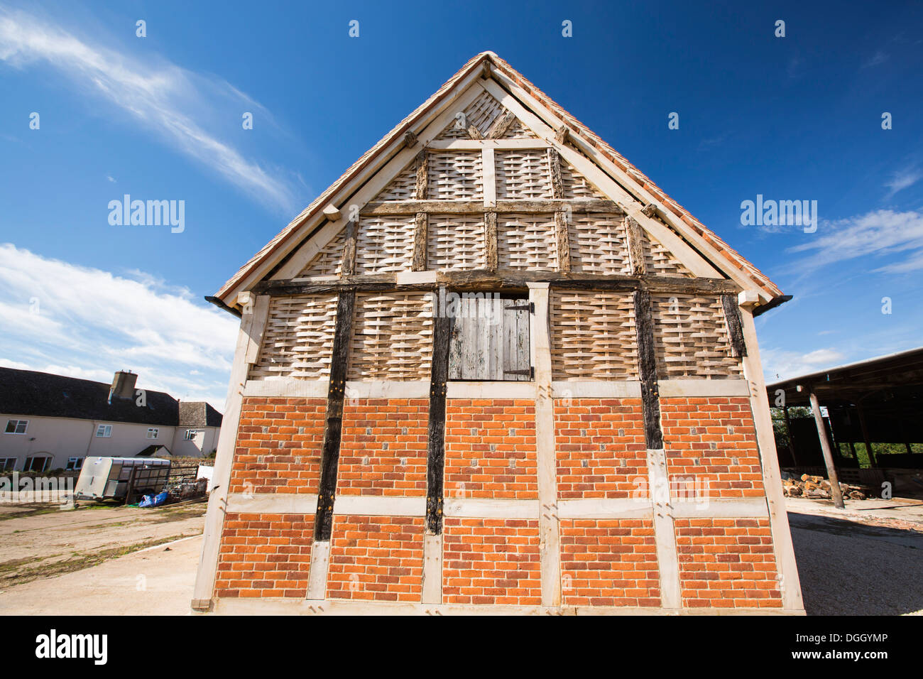 A fantastic old barn with upper walls woven from split timber on a farm ...