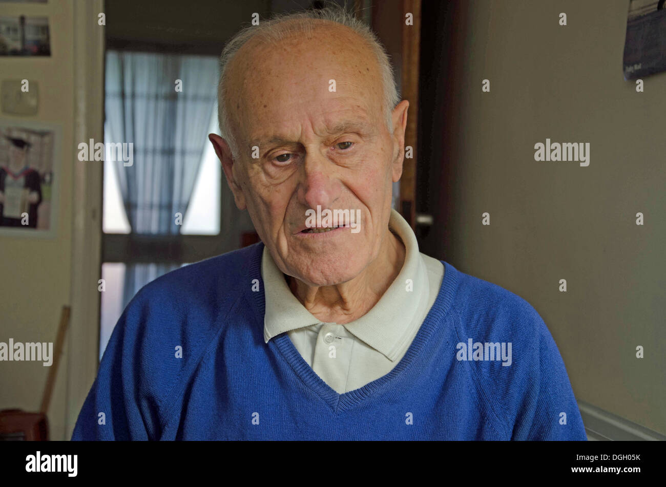 An elderly man with Dementia sitting in his home Stock Photo - Alamy