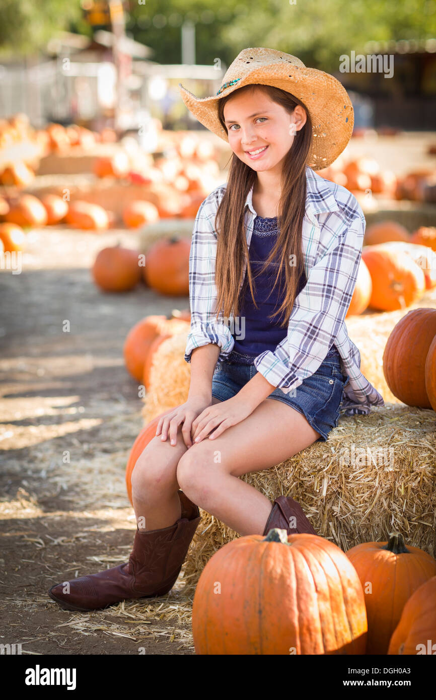 Preteen Girl Wearing Cowboy Hat Portrait at the Pumpkin Patch in a ...