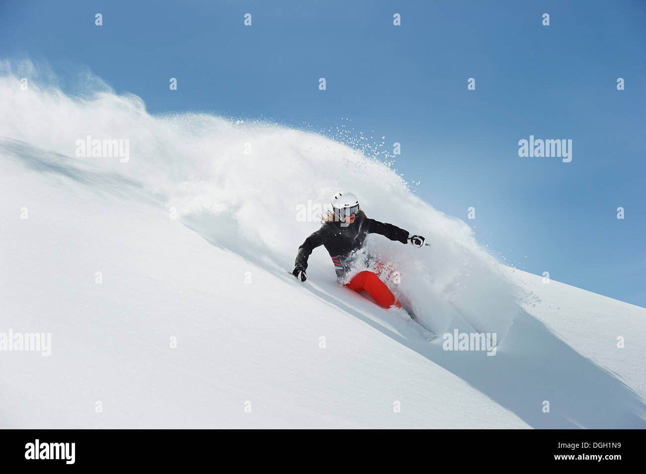 Woman powder skiing hi-res stock photography and images - Alamy