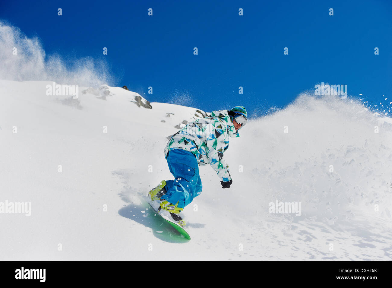 Male snowboarder in action Stock Photo - Alamy