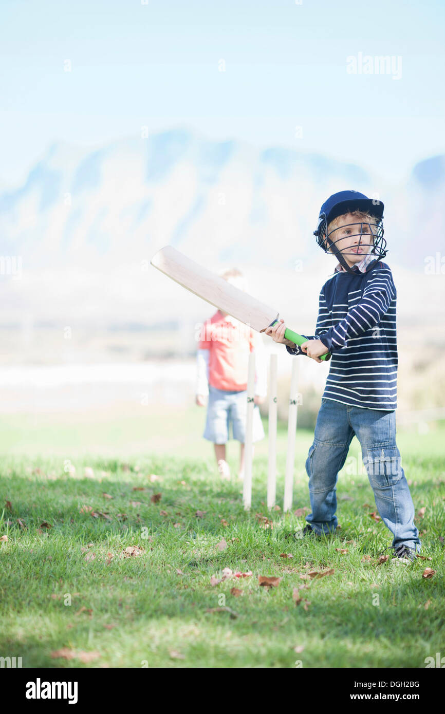 Two boys playing cricket hi-res stock photography and images - Alamy