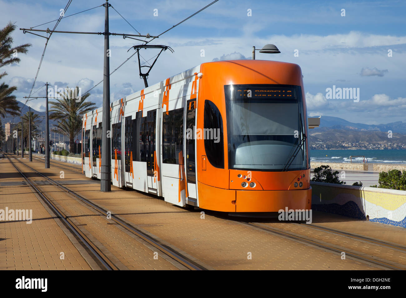 Modern tram serving passengers at southern Europe (Alicante, Spain ...