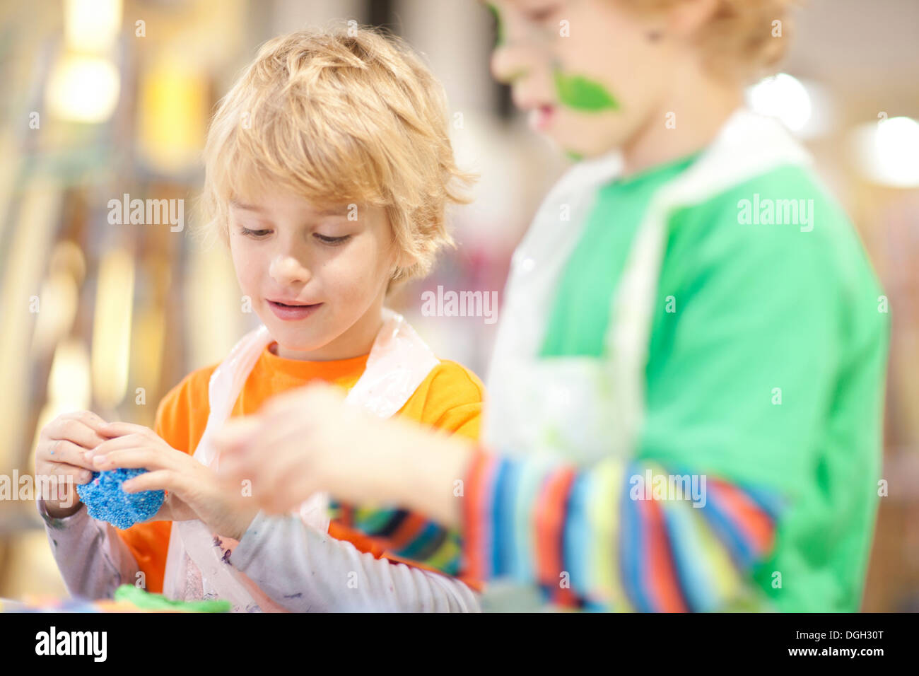 Boys using modelling clay Stock Photo - Alamy