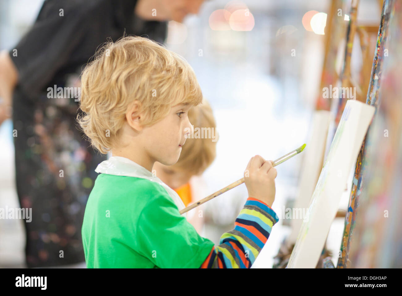 Boy using paintbrush paint hi-res stock photography and images - Alamy