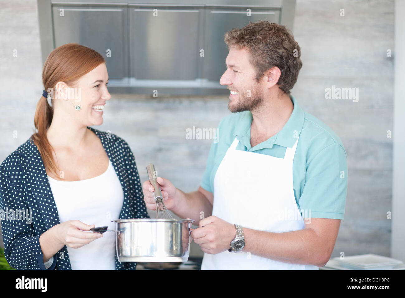 Woman cooking in kitchen hi-res stock photography and images - Alamy