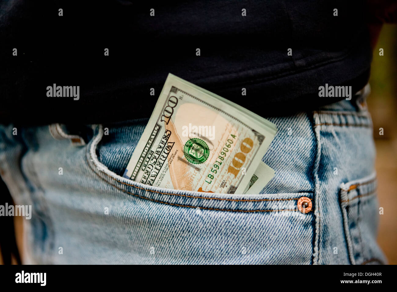 Money sticking out of pants front pocket Stock Photo - Alamy