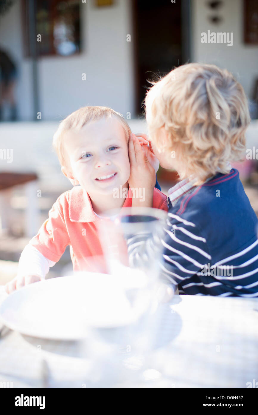 Two boys whispering hi-res stock photography and images - Alamy