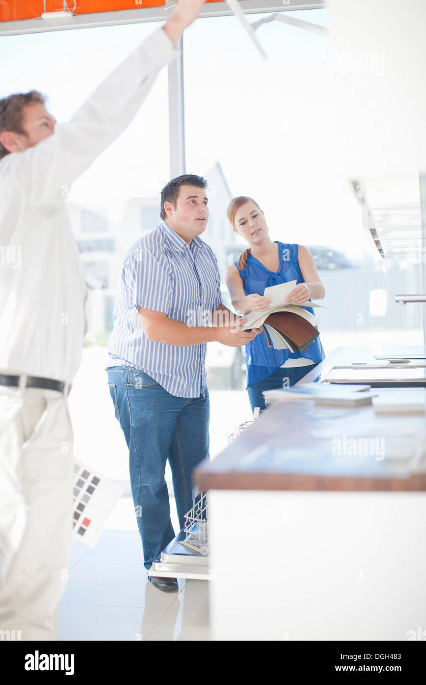 People looking in kitchen showroom Stock Photo - Alamy