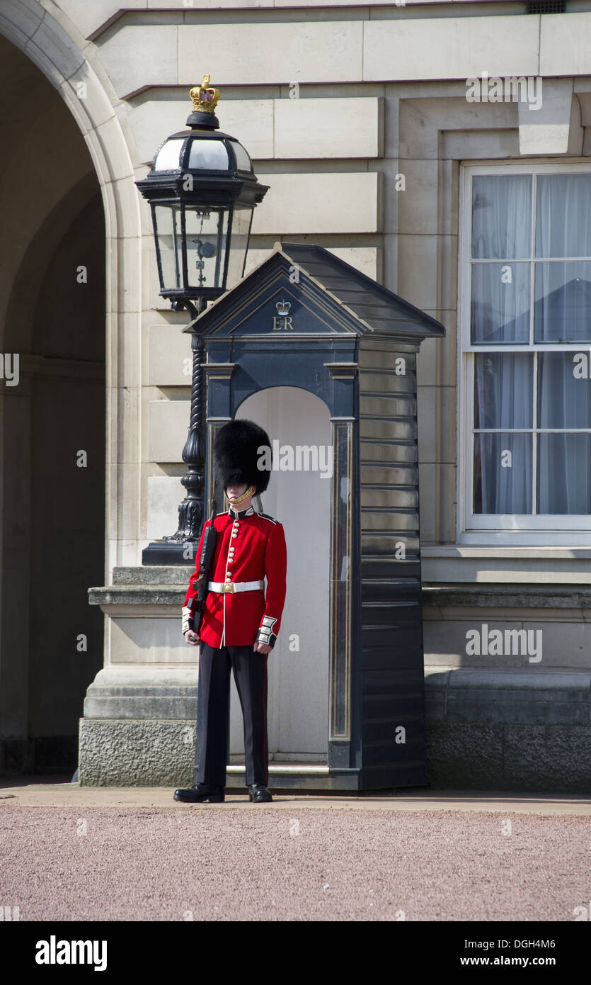 Scots Guards guardsman in ceremonial uniform standing guard beside ...