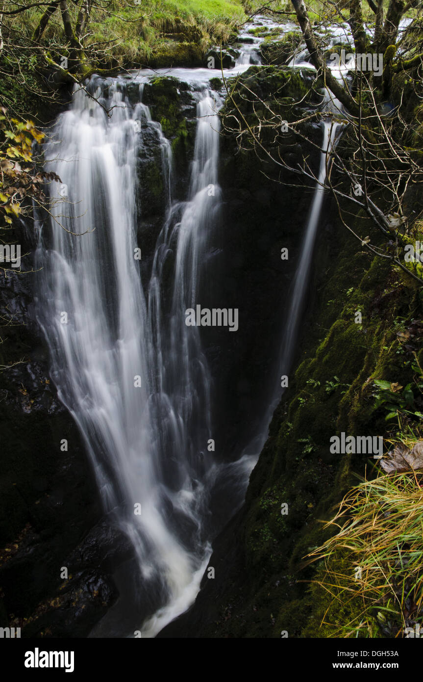 Waterfall cascading through narrow ravine Catrigg Force Stainforth Beck ...