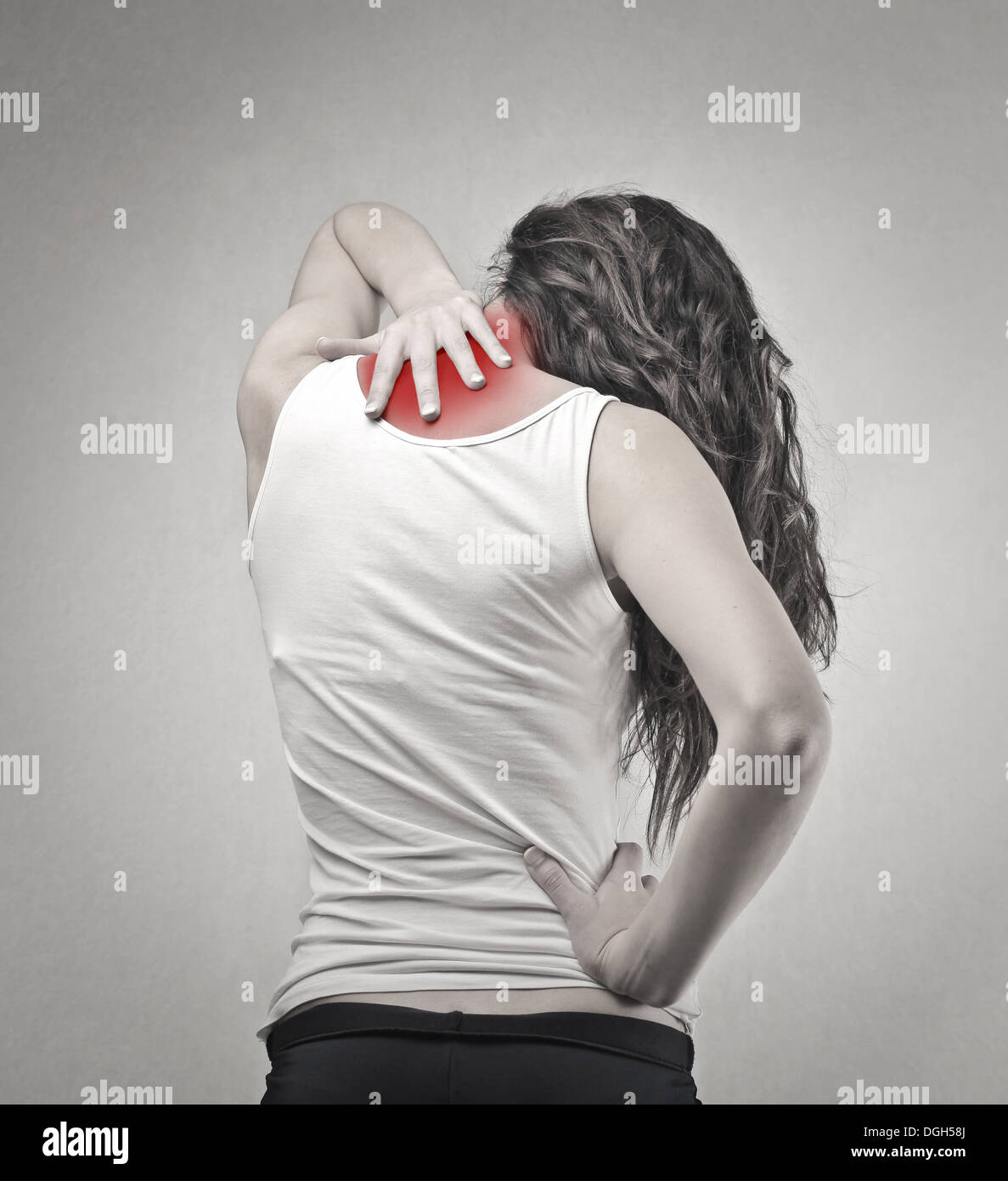 Girl touching her neck highlighted in red Stock Photo - Alamy