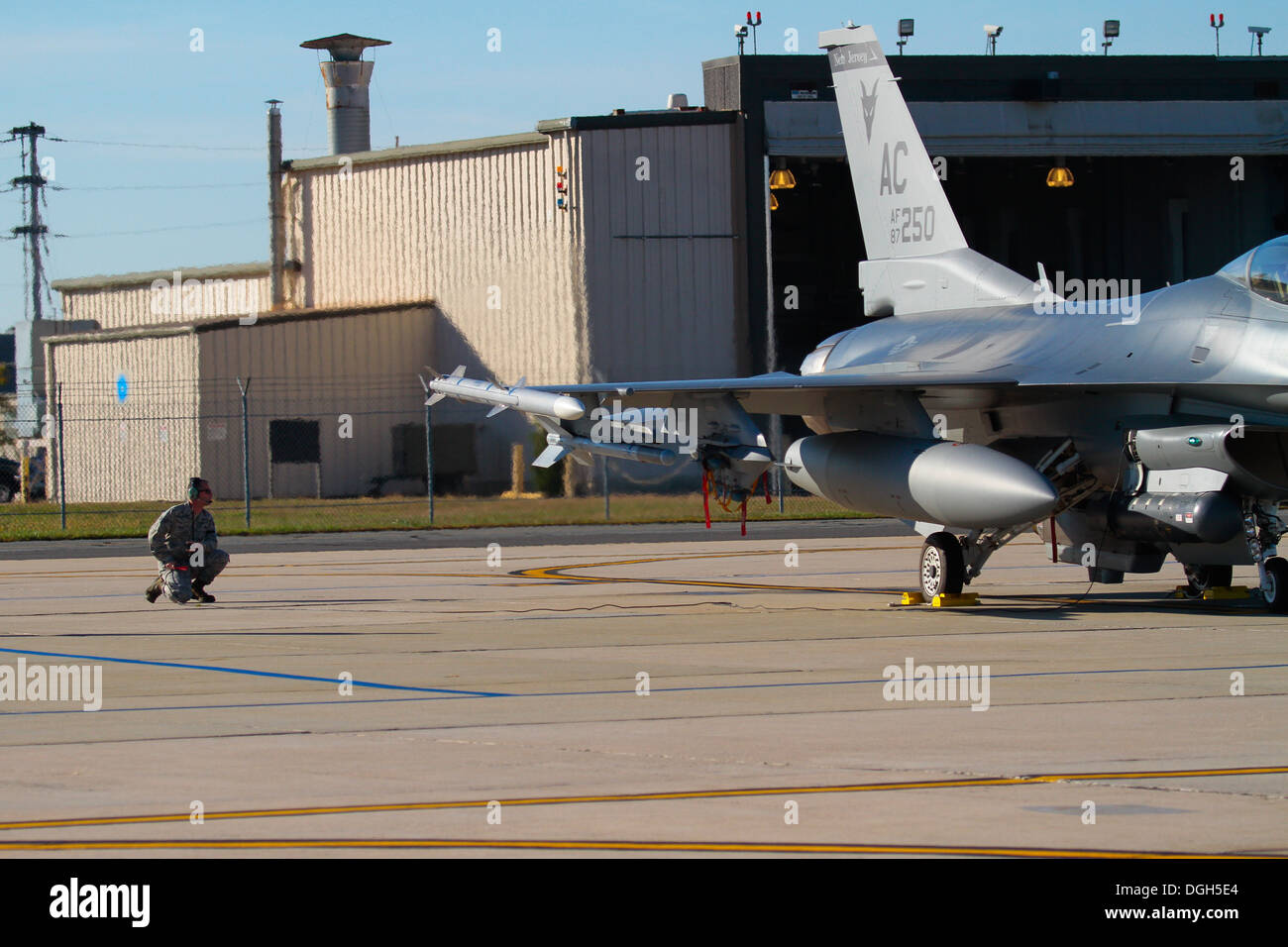 U.S. Air Force Senior Airman Joseph Moffa checks over an F-16C Fighting ...