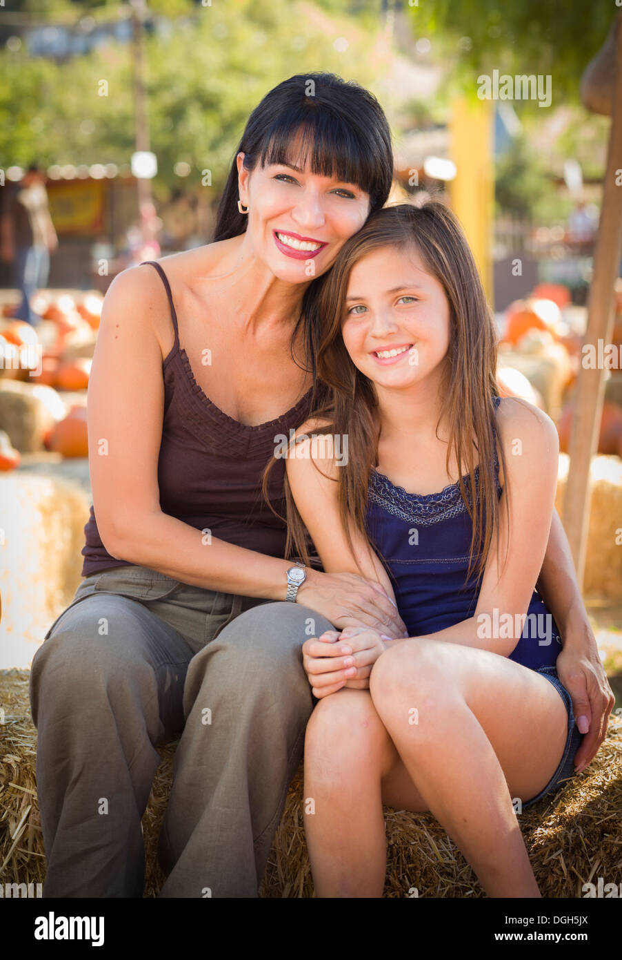 Attractive Mother and Baby Daughter Portrait in a Rustic Ranch Setting ...
