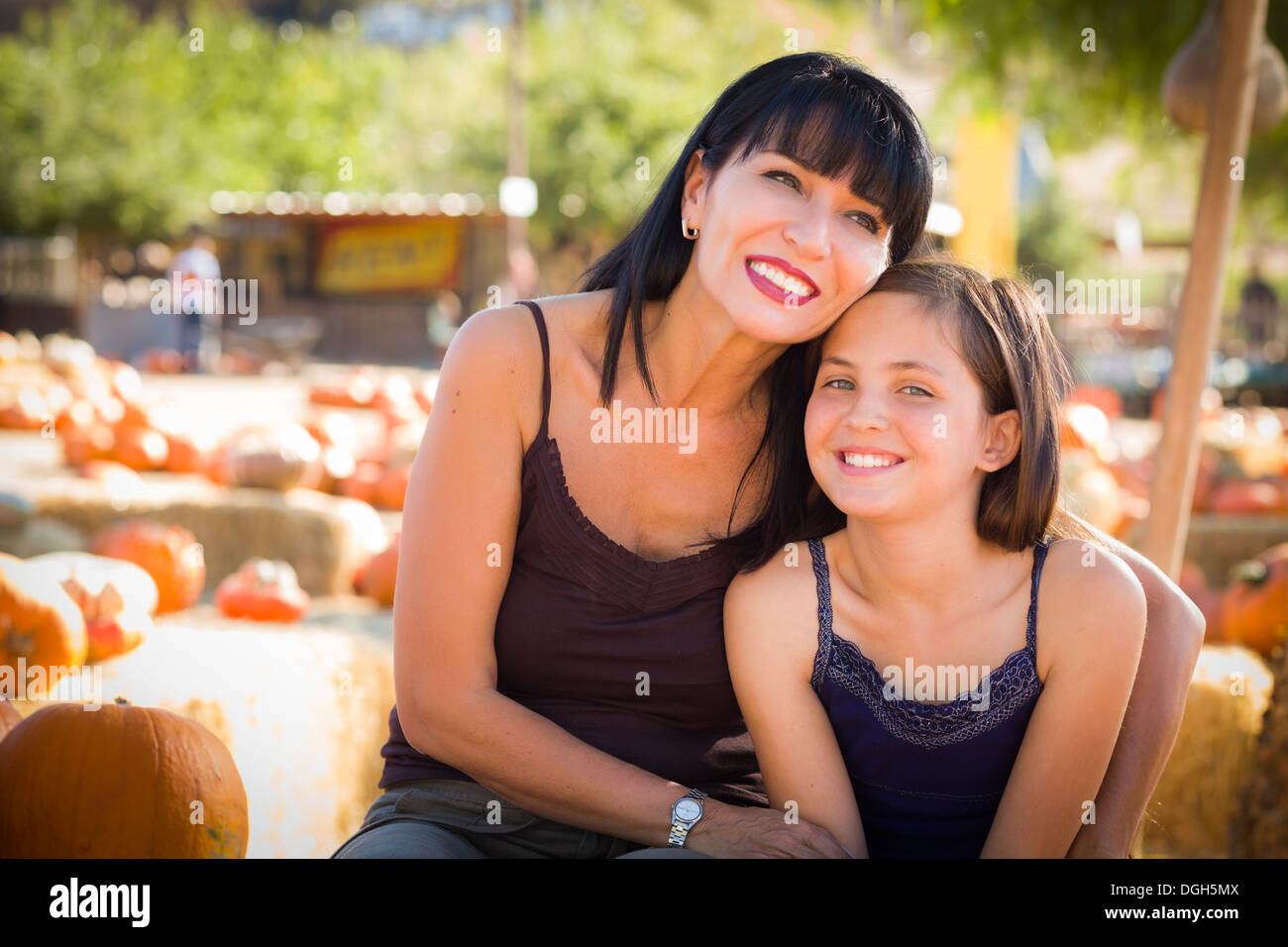 Attractive Mother and Baby Daughter Portrait in a Rustic Ranch Setting ...