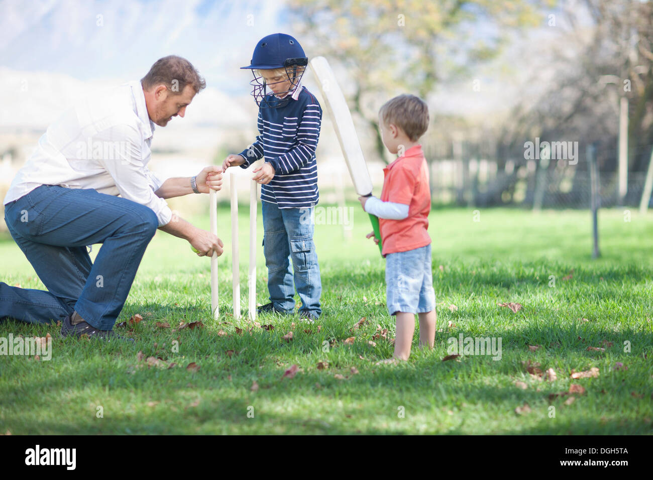 Boy playing cricket father hi-res stock photography and images - Alamy