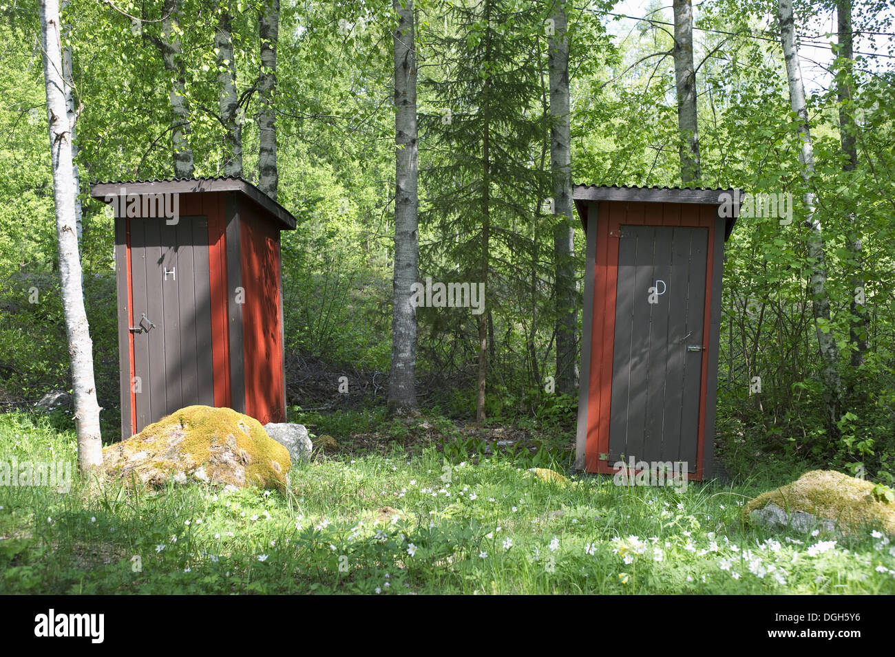 Outside lavatories for gentlemen (H) and ladies (D) at edge of forest ...