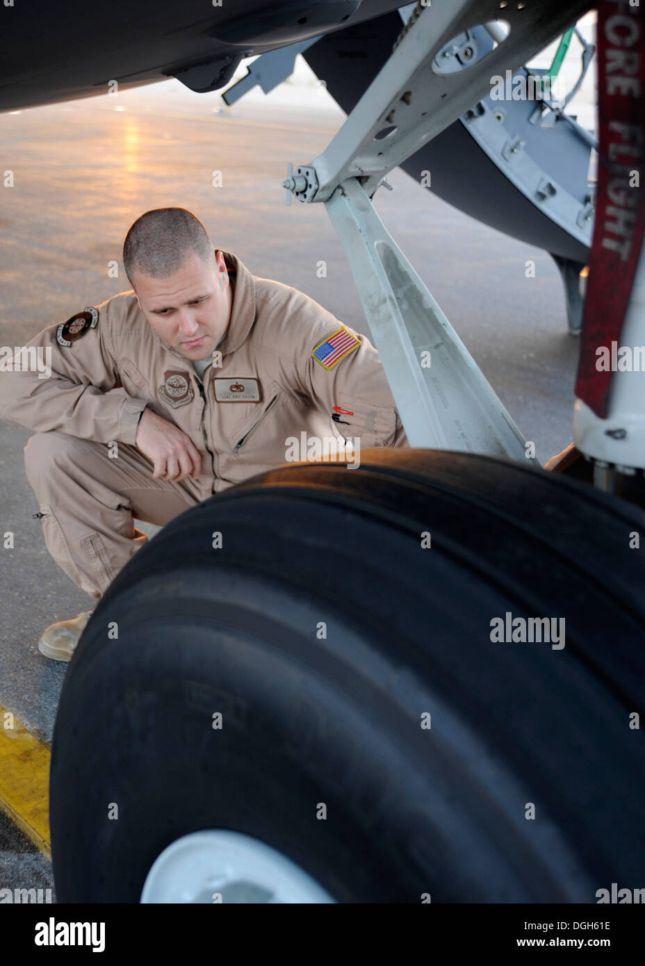 Staff Sgt. Eric Eason performs a preflight on the exterior of a C-17 ...