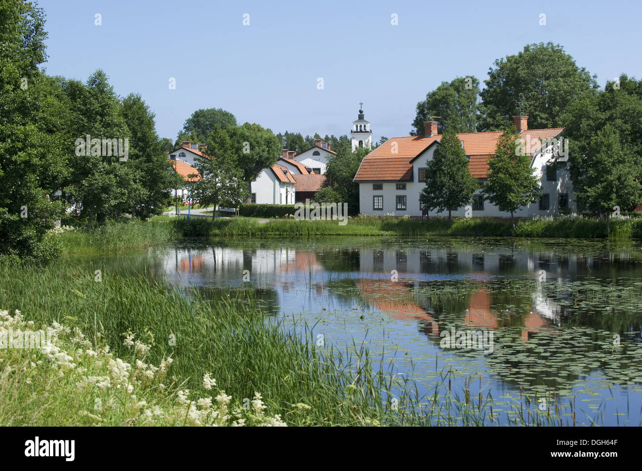 View of pond and historic ironworks village, Forsmarks, Uppland, Sweden ...