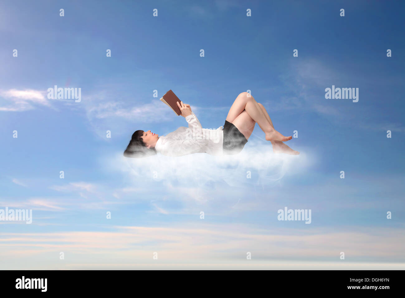 Girl reading book on cloud hi-res stock photography and images - Alamy
