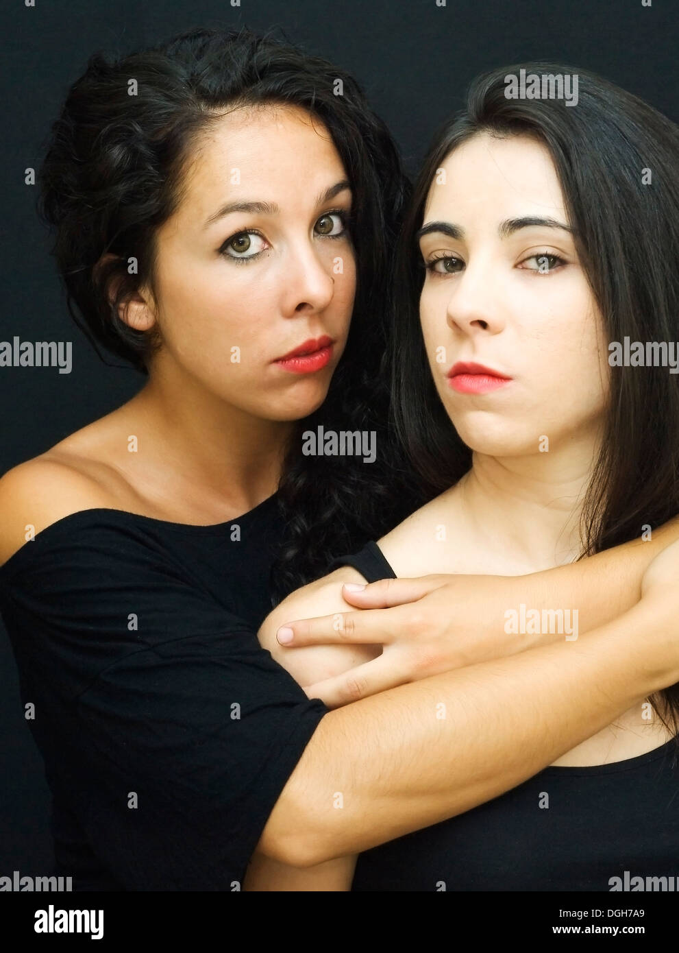 Two beautiful friends embrace one another Stock Photo - Alamy