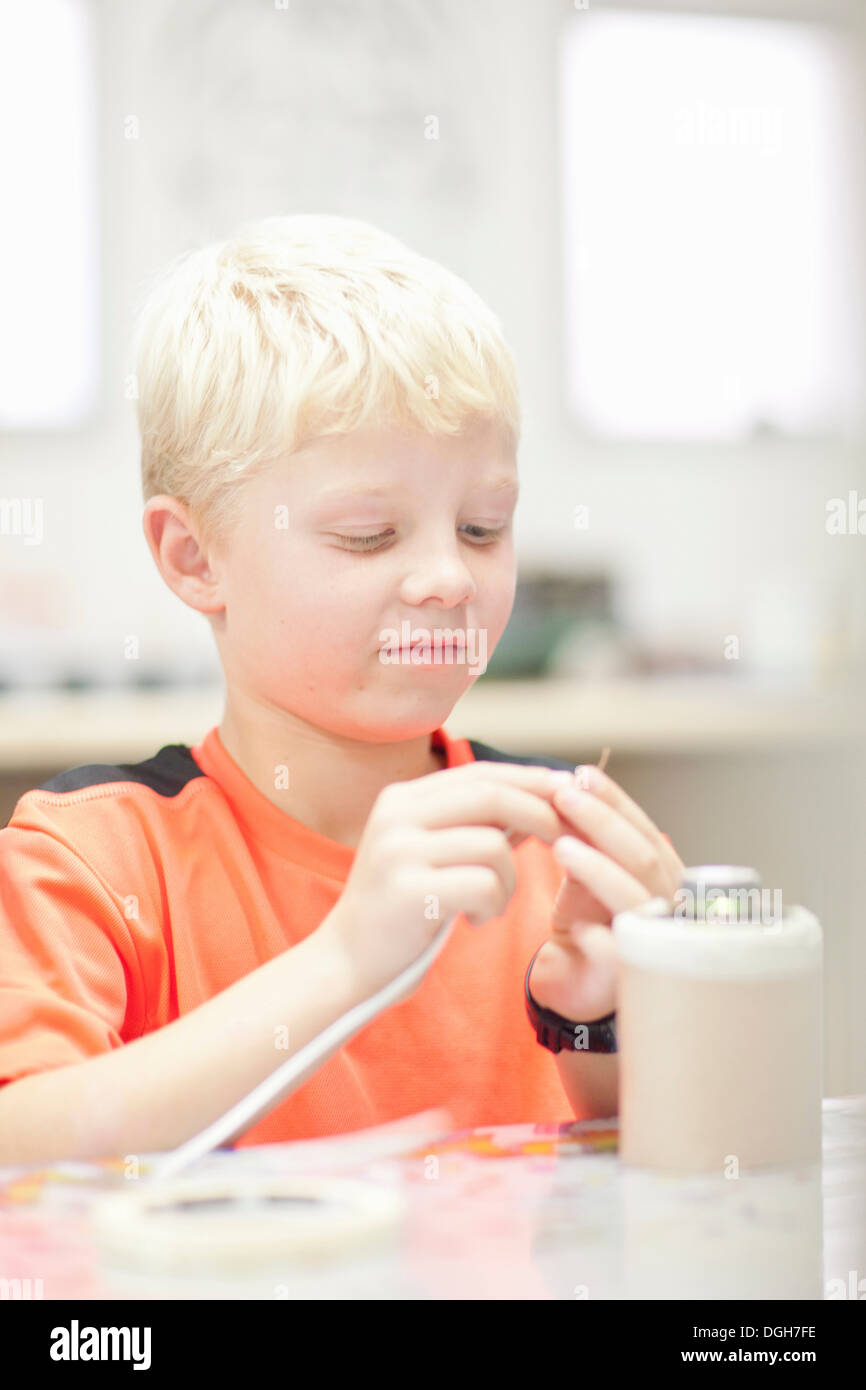 Boy making craft object Stock Photo - Alamy