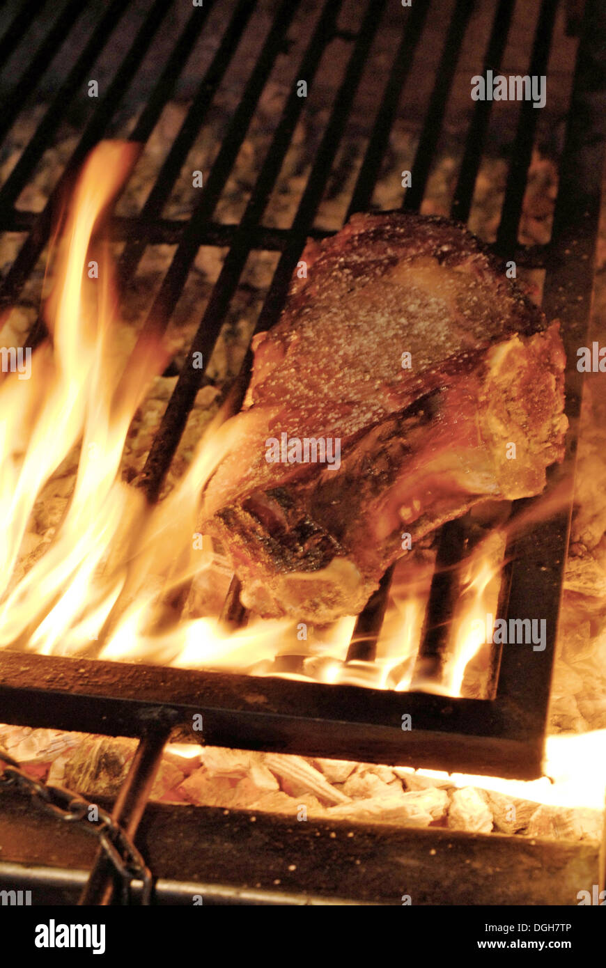 Beef meat being cooked on a grill at Asador Encina, Ibiza Stock Photo ...