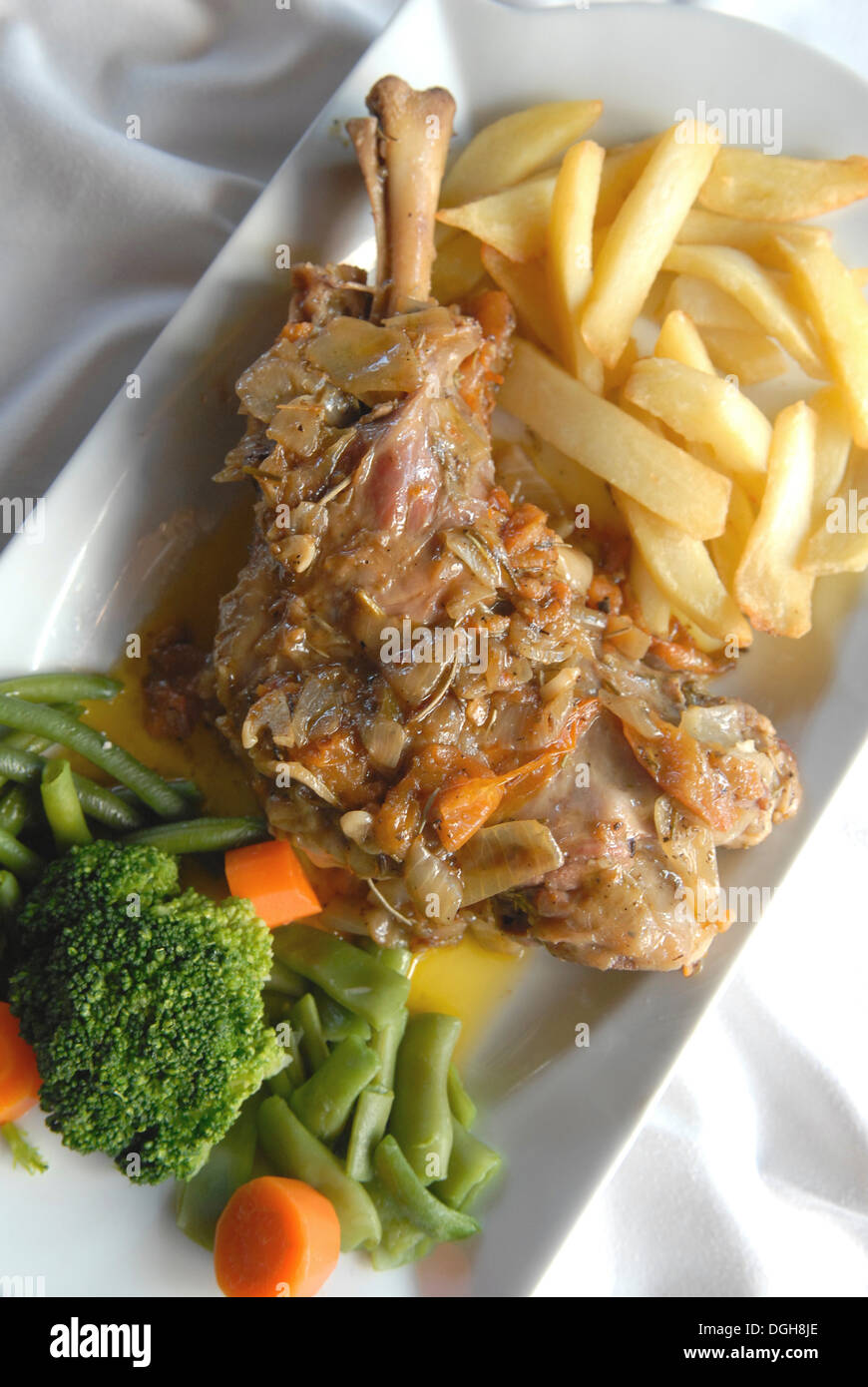 Spanish typical Paletilla de cordero made with lamb meat, with fries ...