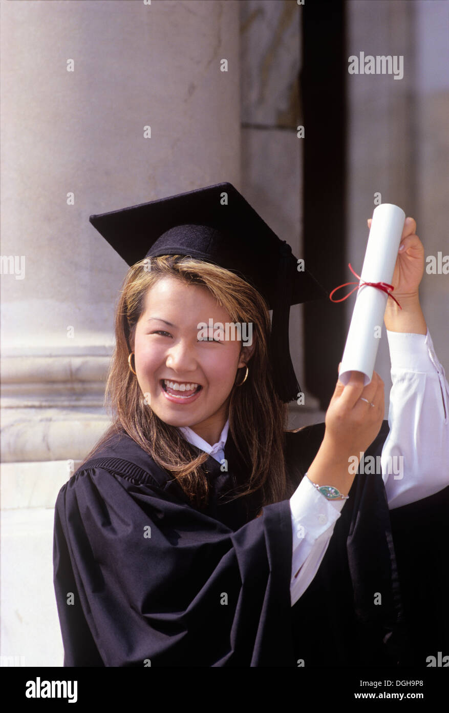 Korean woman holding diploma celebrates graduation from university ...
