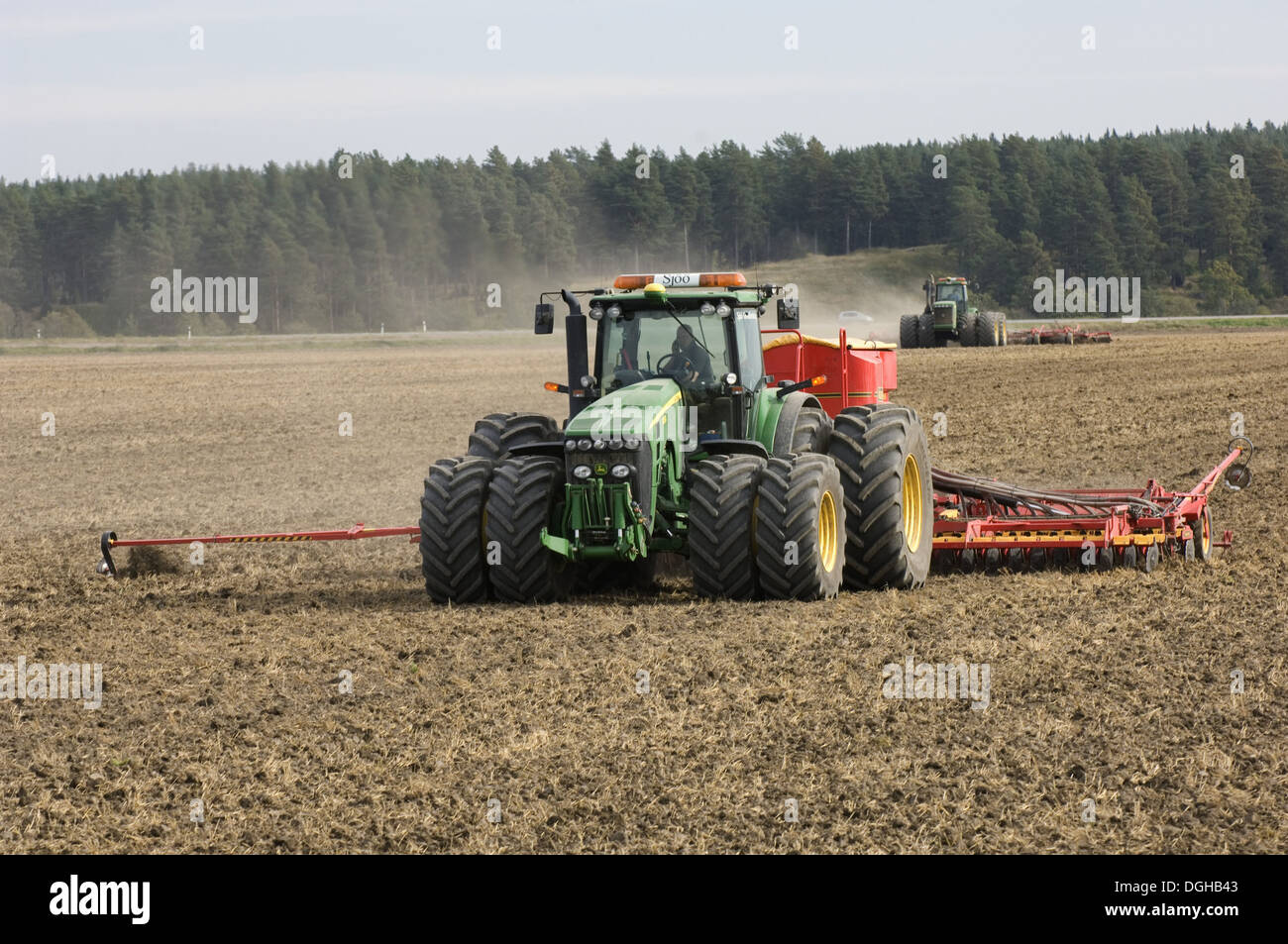 John Deere 8530 tractor, drilling and harrowing field, Sweden, autumn ...