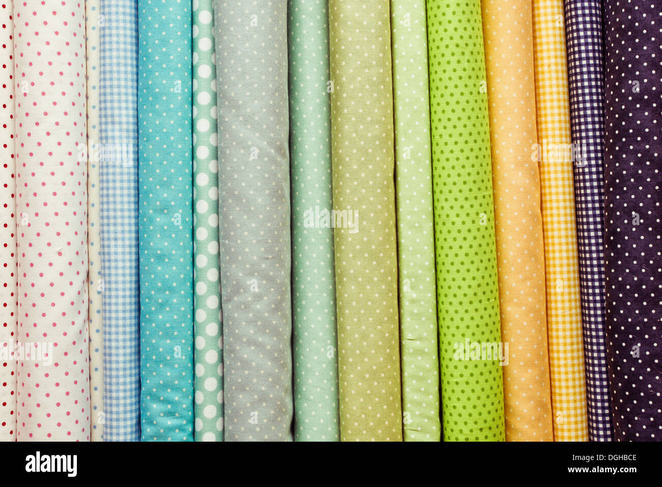 Rolls of colorful fabric as a vibrant background image Stock Photo - Alamy