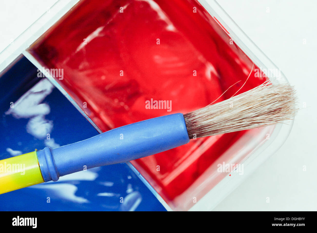 Mixing paint red yellow orange brush hi-res stock photography and ...
