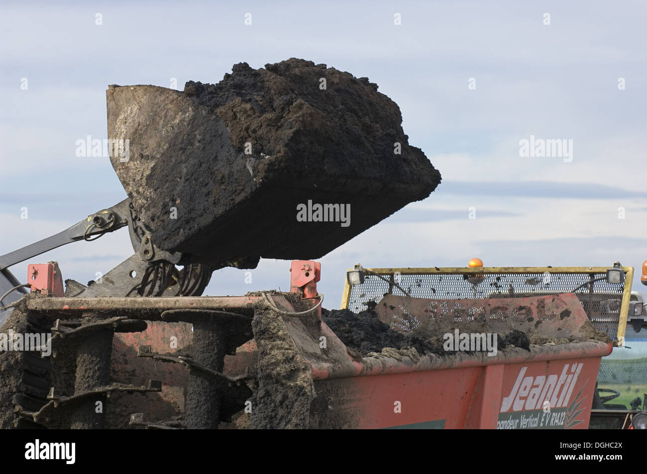 Loader bucket with muck, loading muck spreader, Sweden, autumn Stock ...