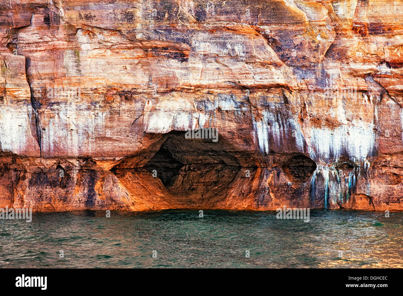 Naturally formed caves among the sandstone cliffs at Pictured Rocks ...