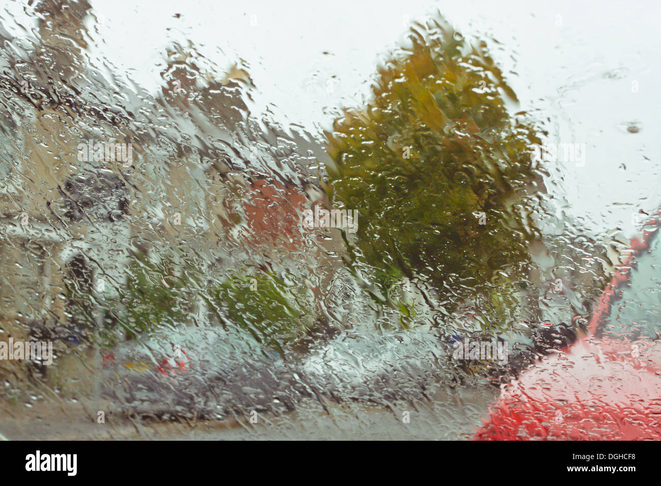View of a street through a wet windscreen on a rainy day Stock Photo ...