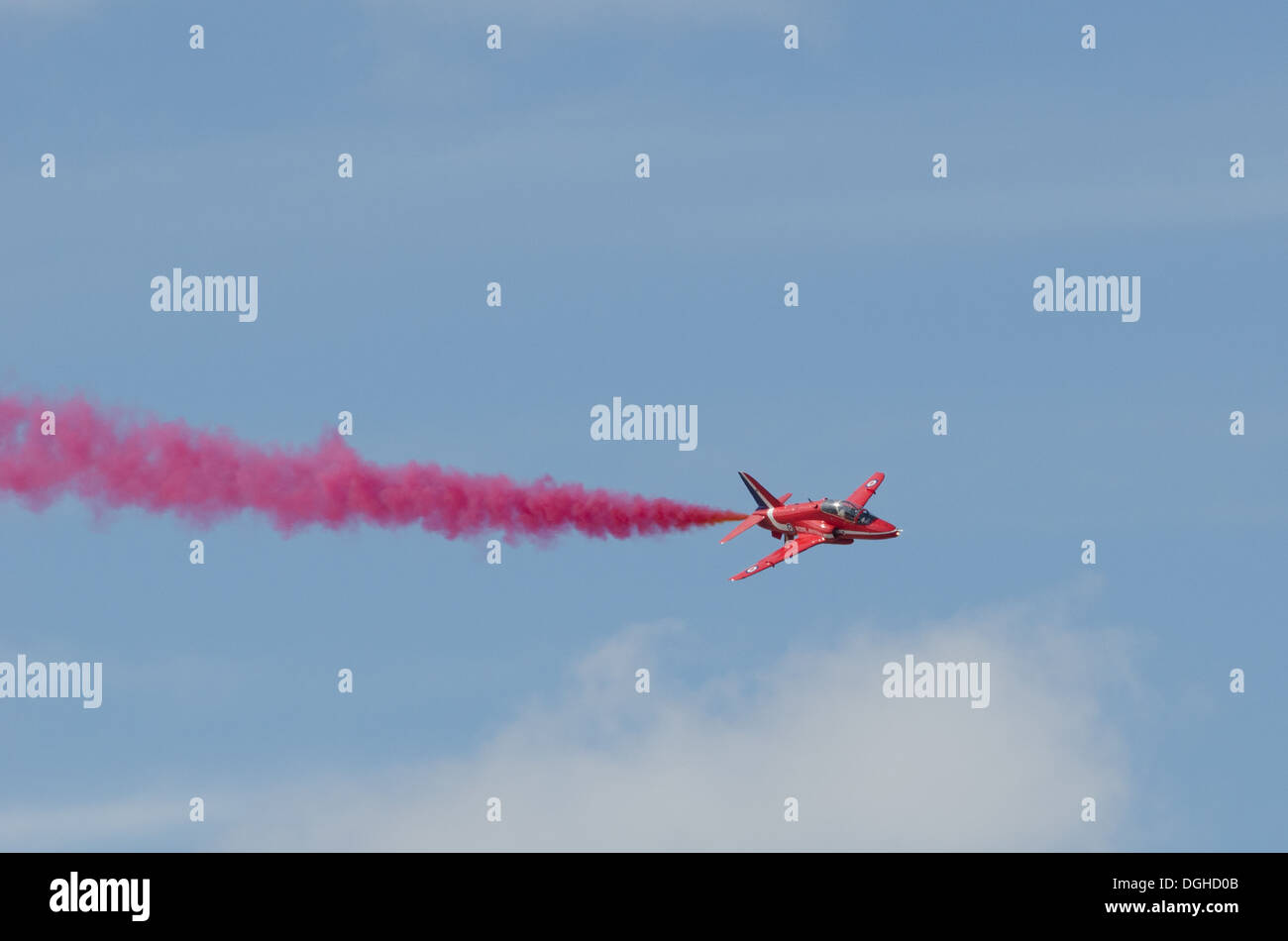 Single RAF Red Arrows perform an acrobatic maneuver with smoke at the ...