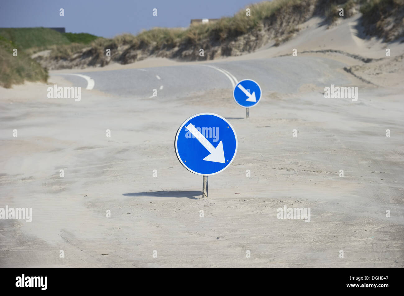 Driving direction signs on sandy beach at start of road, Romo, Wadden ...