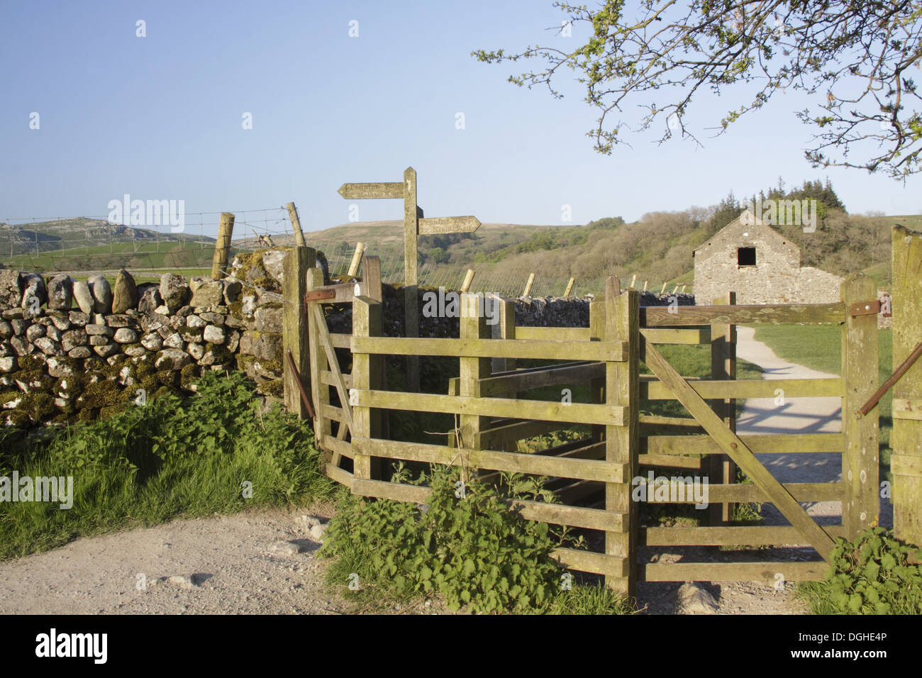Pennine Way' signpost and wooden kissing gates along public footpath ...