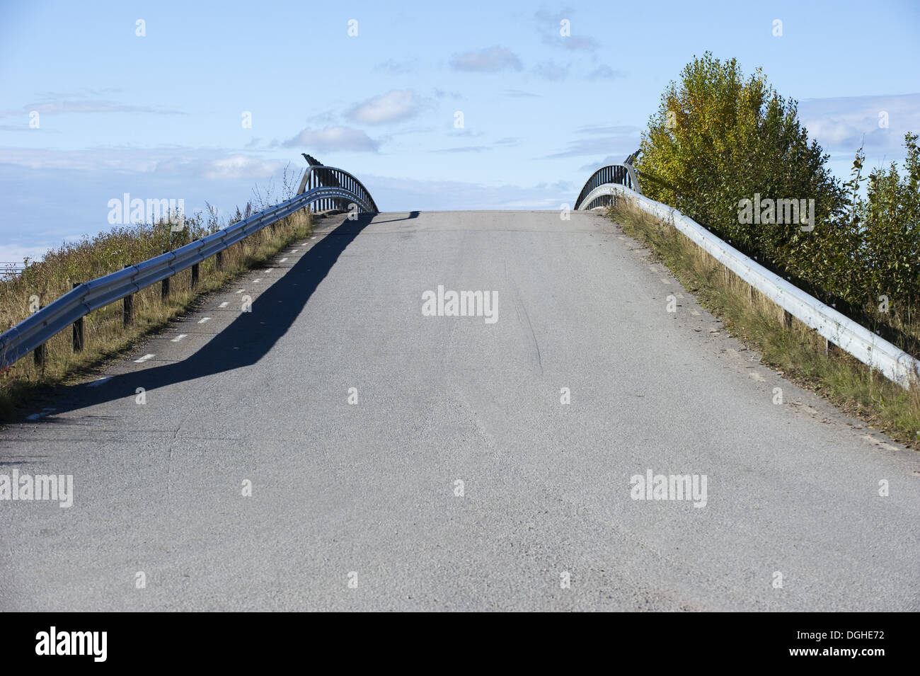 Road over humpback bridge, Sweden, september Stock Photo - Alamy
