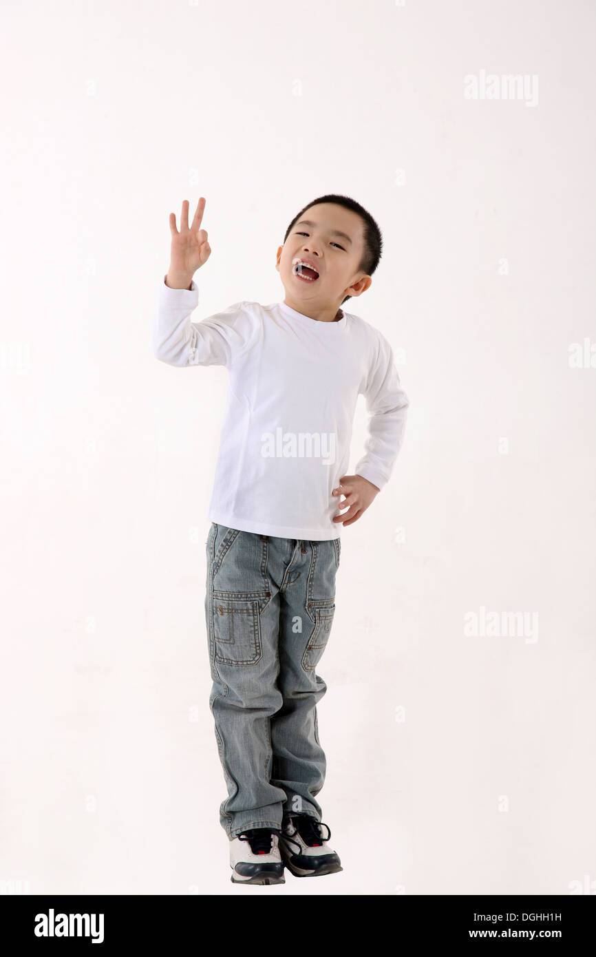 East Asian Boy Standing On The Floor High Resolution Stock Photography ...