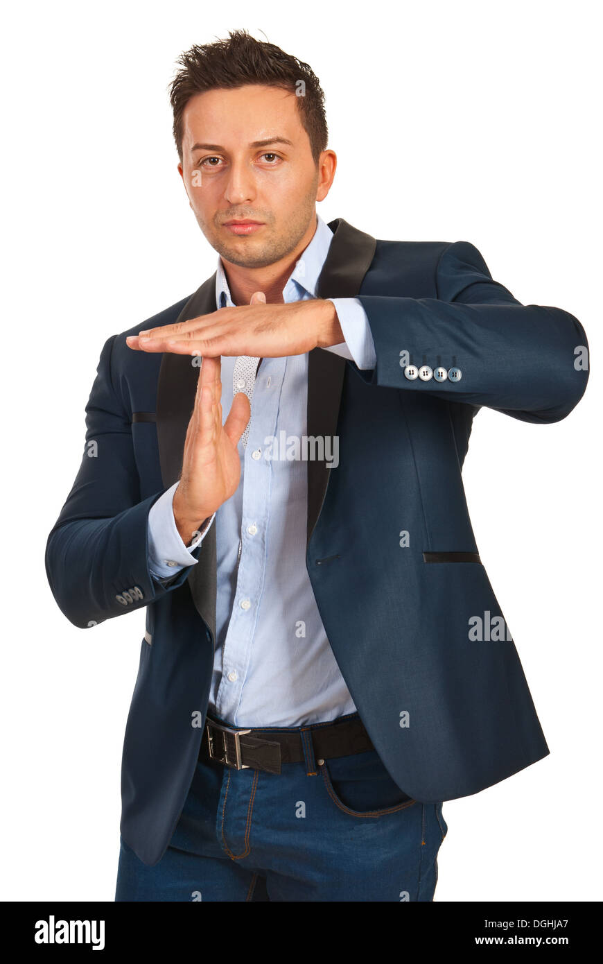 Executive man gesturing time out with his hands isolated on white ...