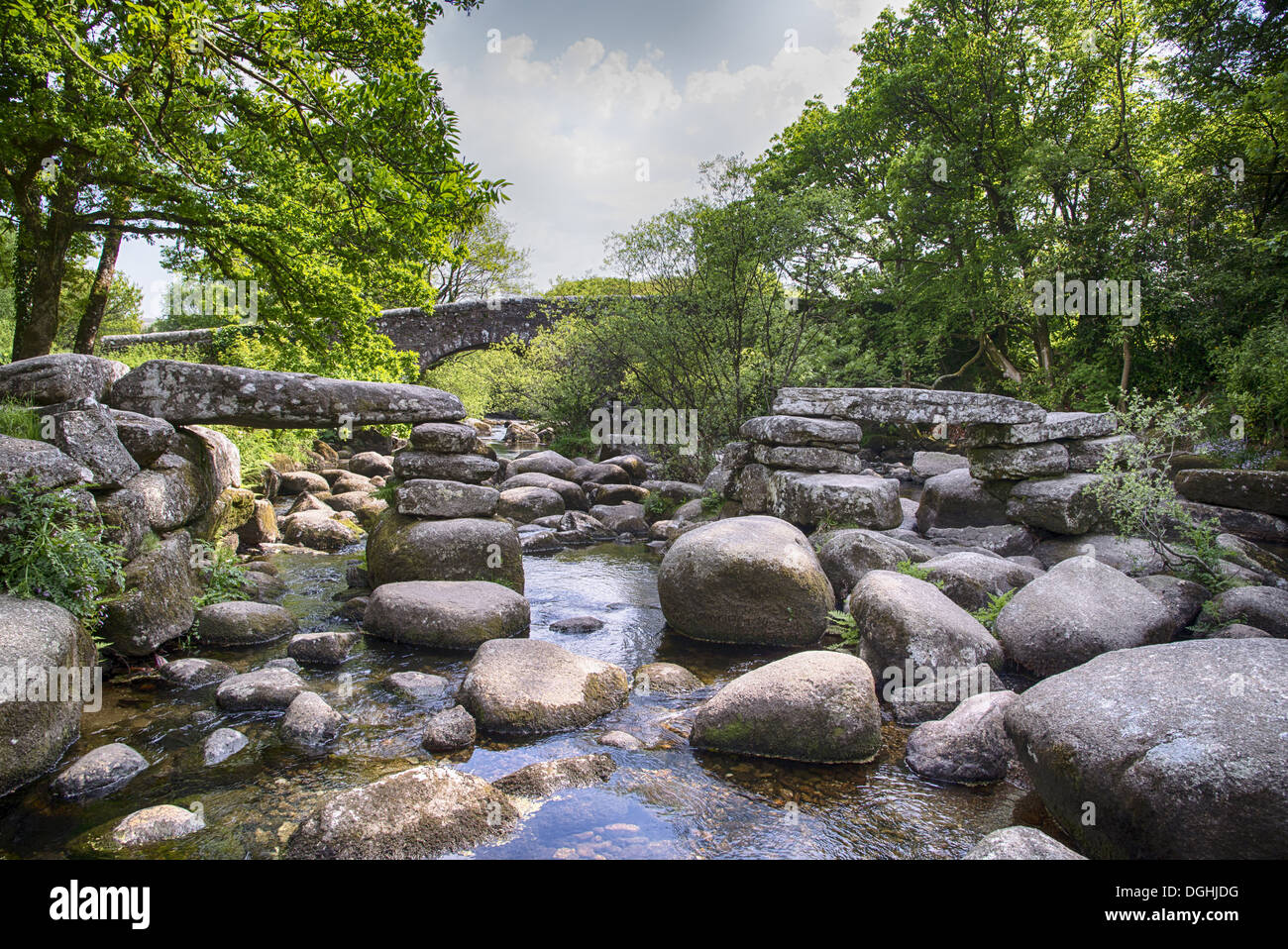 View of river with partially collapsed clapper bridge, Dartmeet Clapper ...