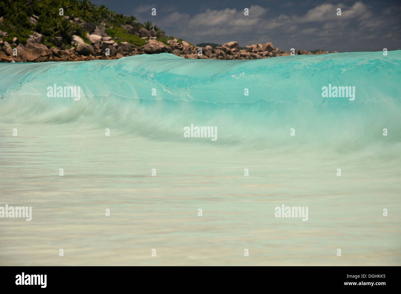 Breaking Wave in Tropical Water Stock Photo - Alamy