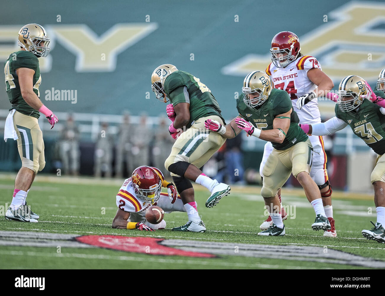 Baylor Bears defensive lineman Byron Bonds (96) jumps on top of Iowa ...