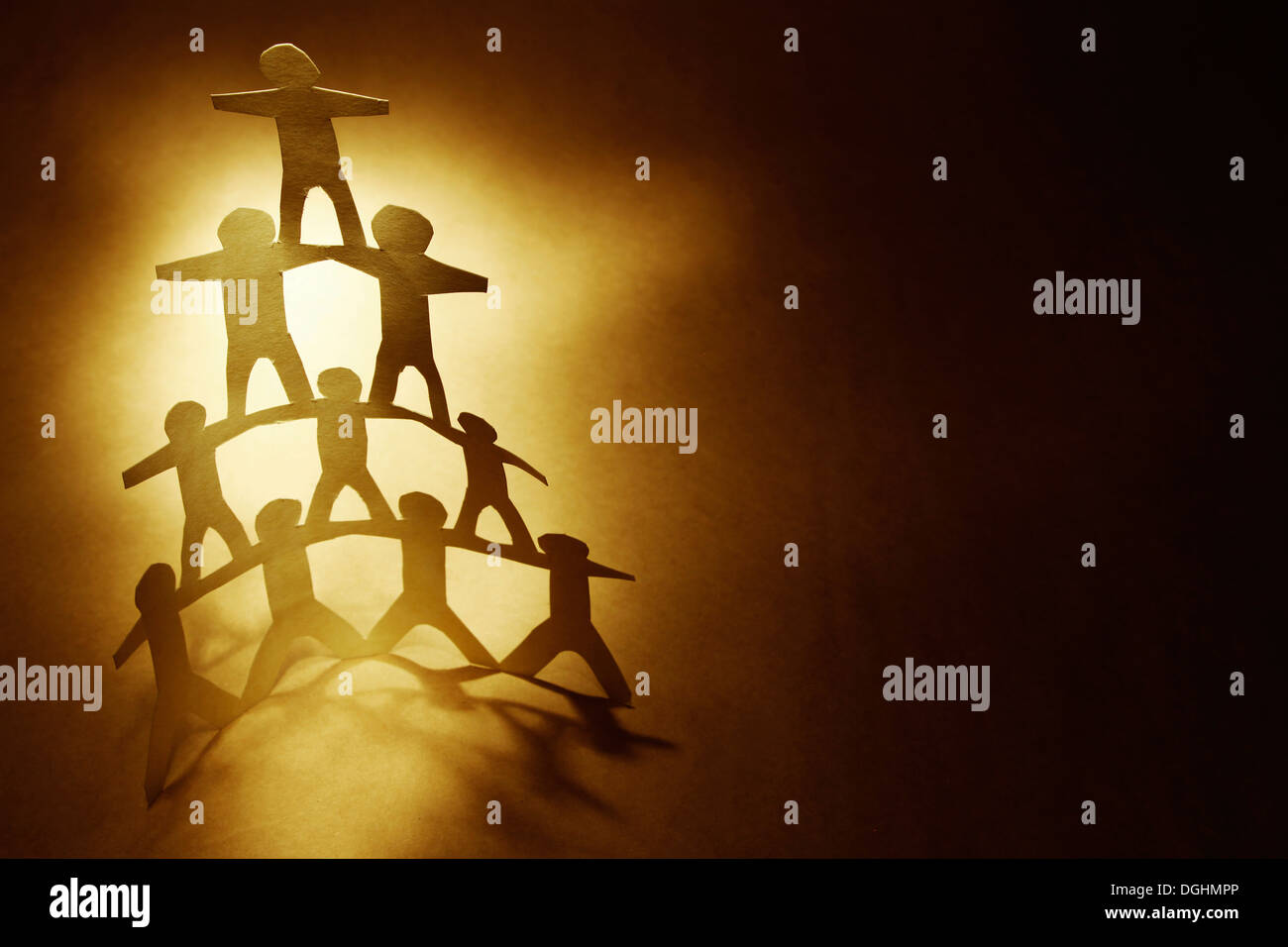 Human team pyramid. Copy space Stock Photo - Alamy